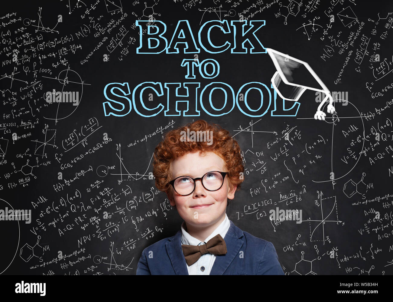 Clever kid student boy on chalkboard background with Back to school ...