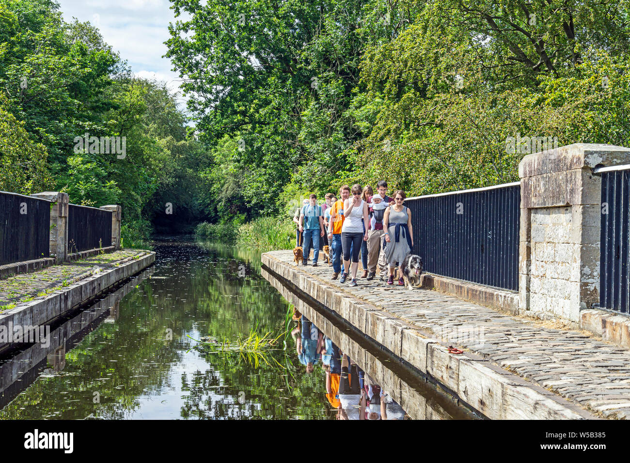 Walkers crossing the Avon Viaduct on The Union Canal near Linlithgow ...