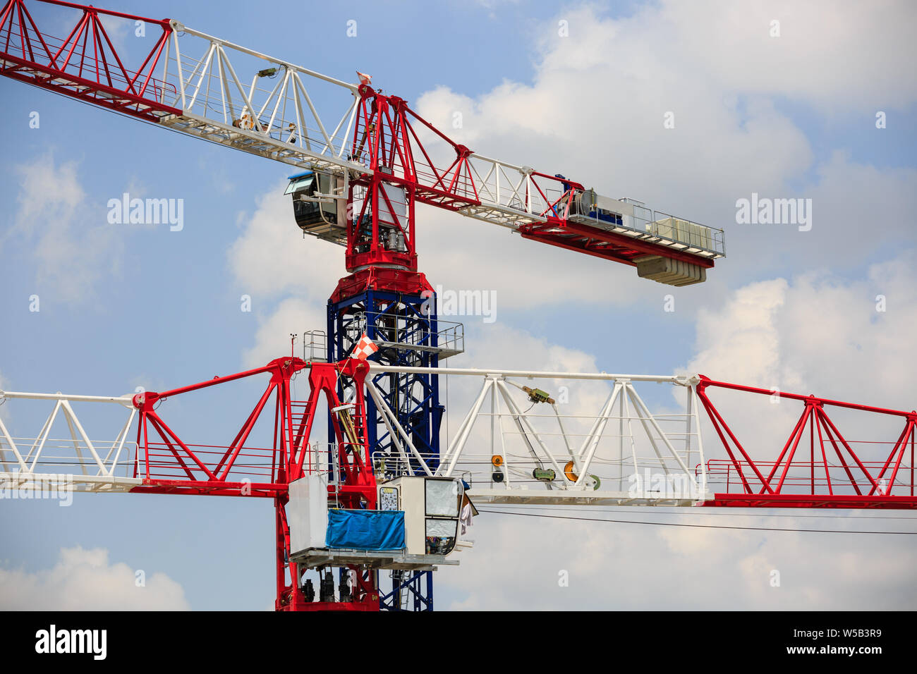 Tower crane detail view in blue sky Stock Photo - Alamy