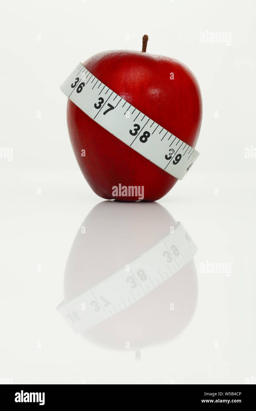 Apple with tape measure Stock Photo - Alamy