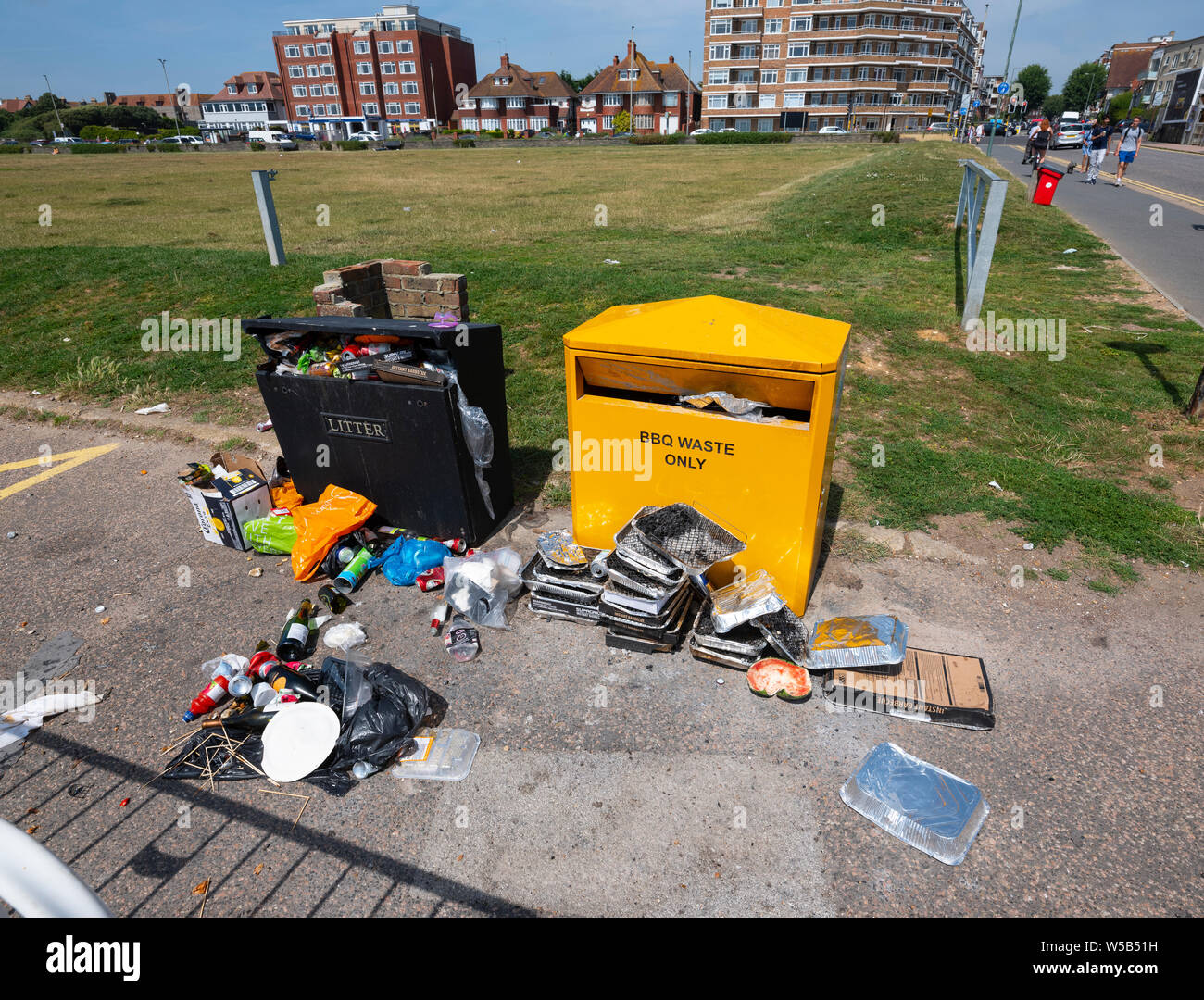 Litter Bins with BBQ waste and general waste and rubbish spilling over ...