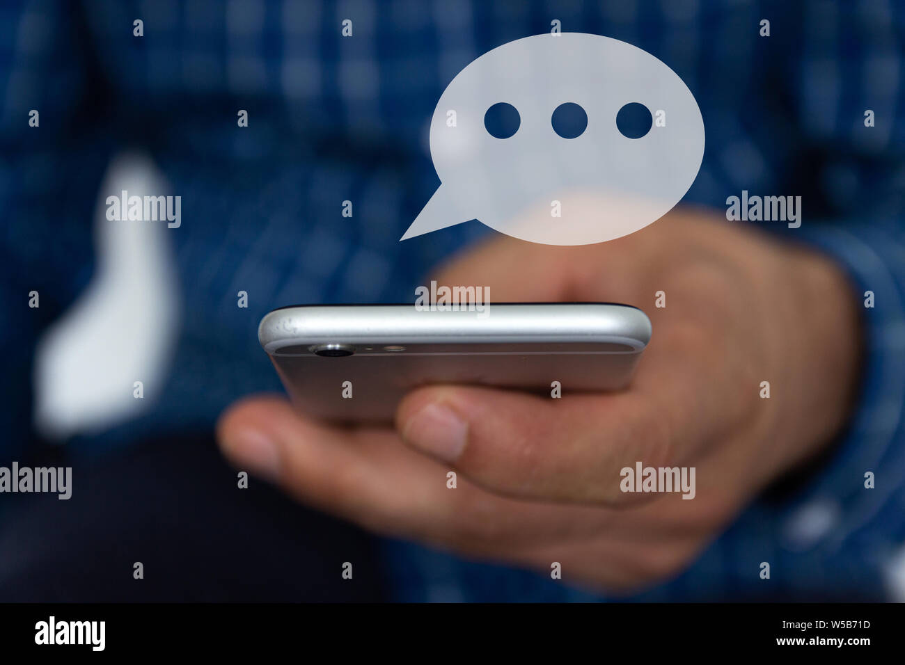 Hand of man typing text on mobile smartphone. Online chat chatting on ...