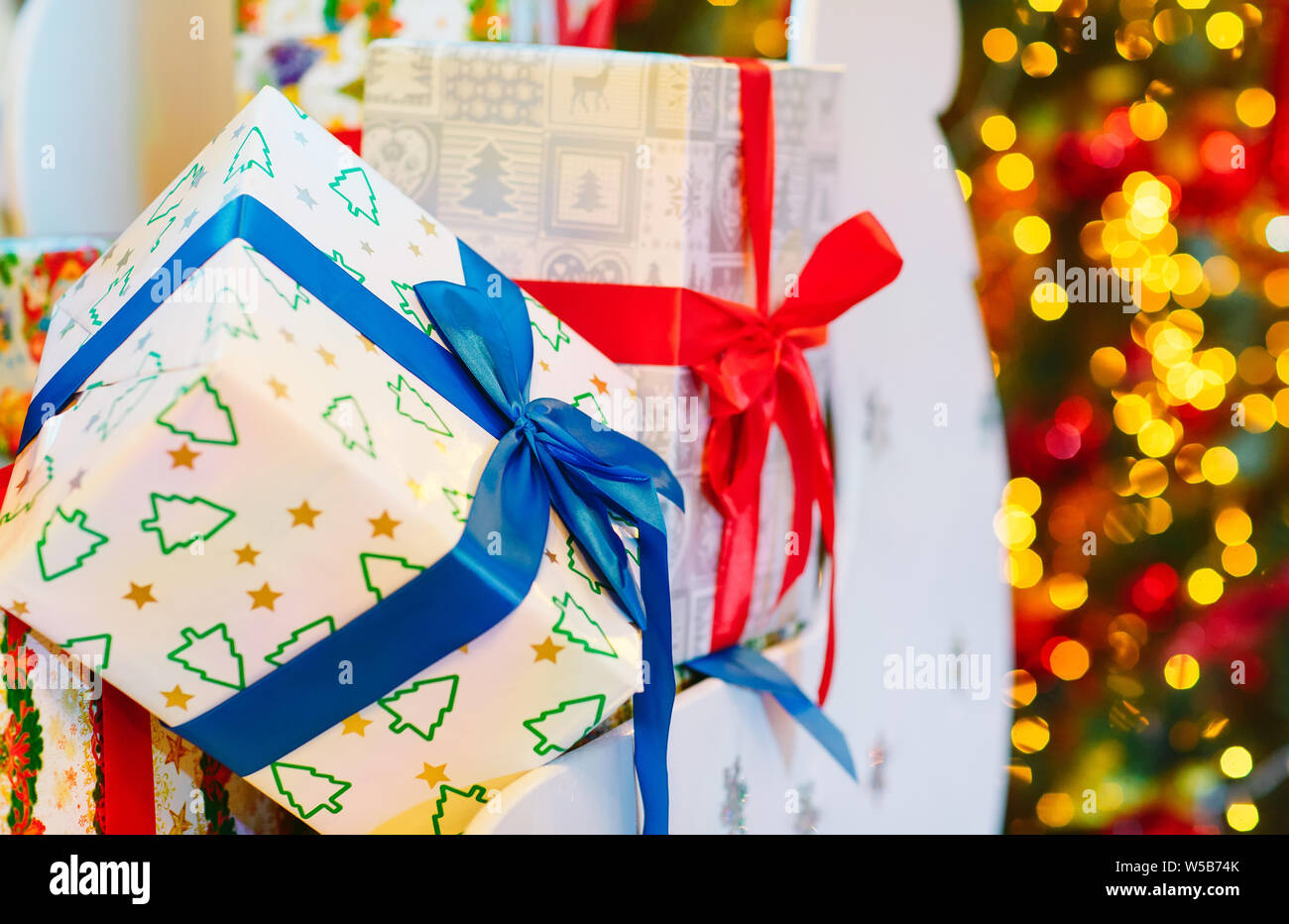 new year gifts, boxes with blue and red ribbon Stock Photo - Alamy