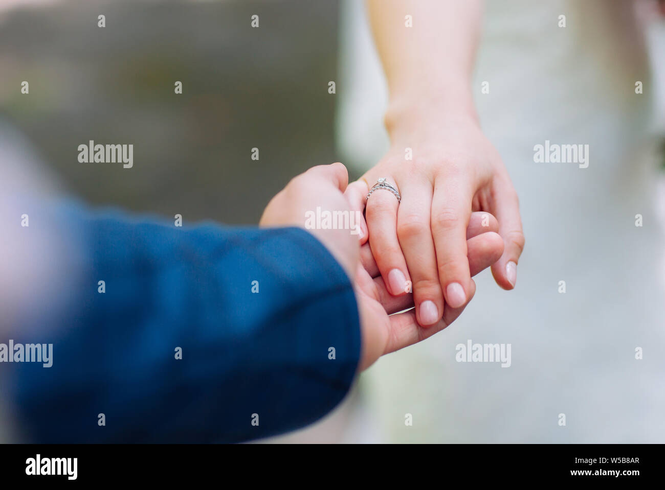 Wedding day groom touching hand hi-res stock photography and images - Alamy