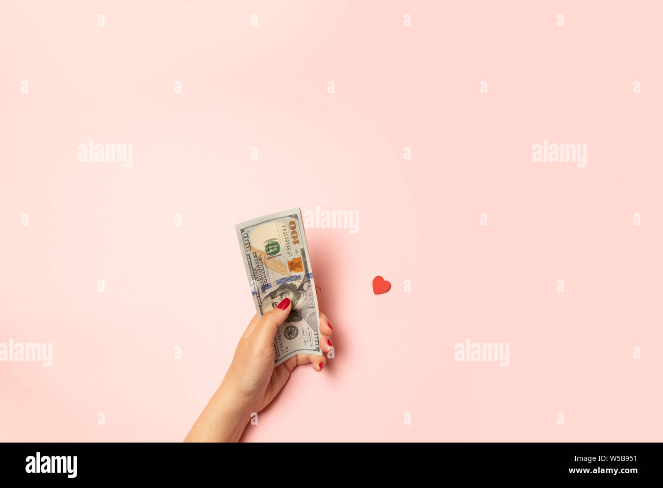 Copper bronze heart shape in center of dollar money background Stock ...