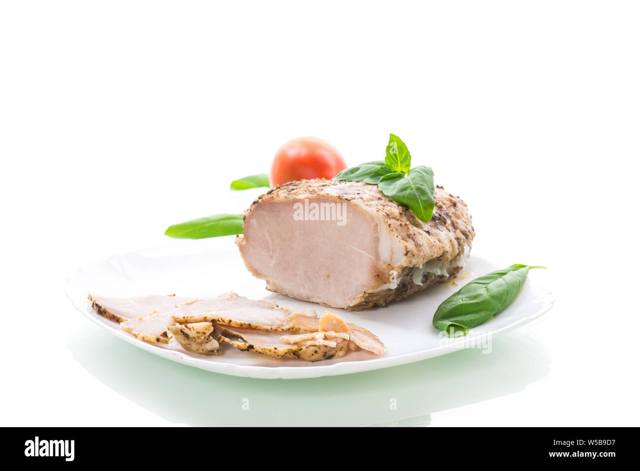 homemade baked meat with spices iin a plate on white background Stock ...