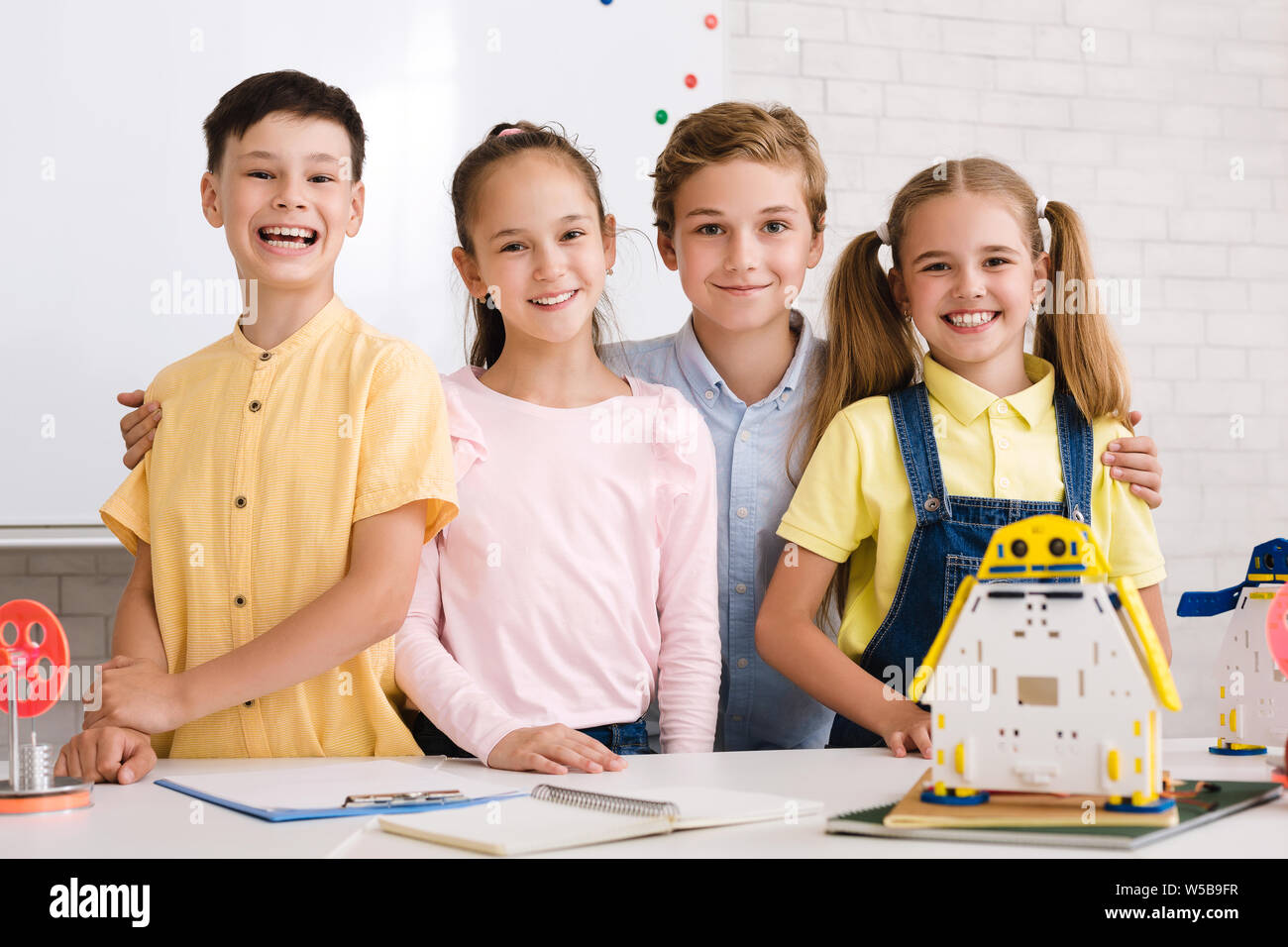 Portrait of pupils building robots in after school stem class Stock ...