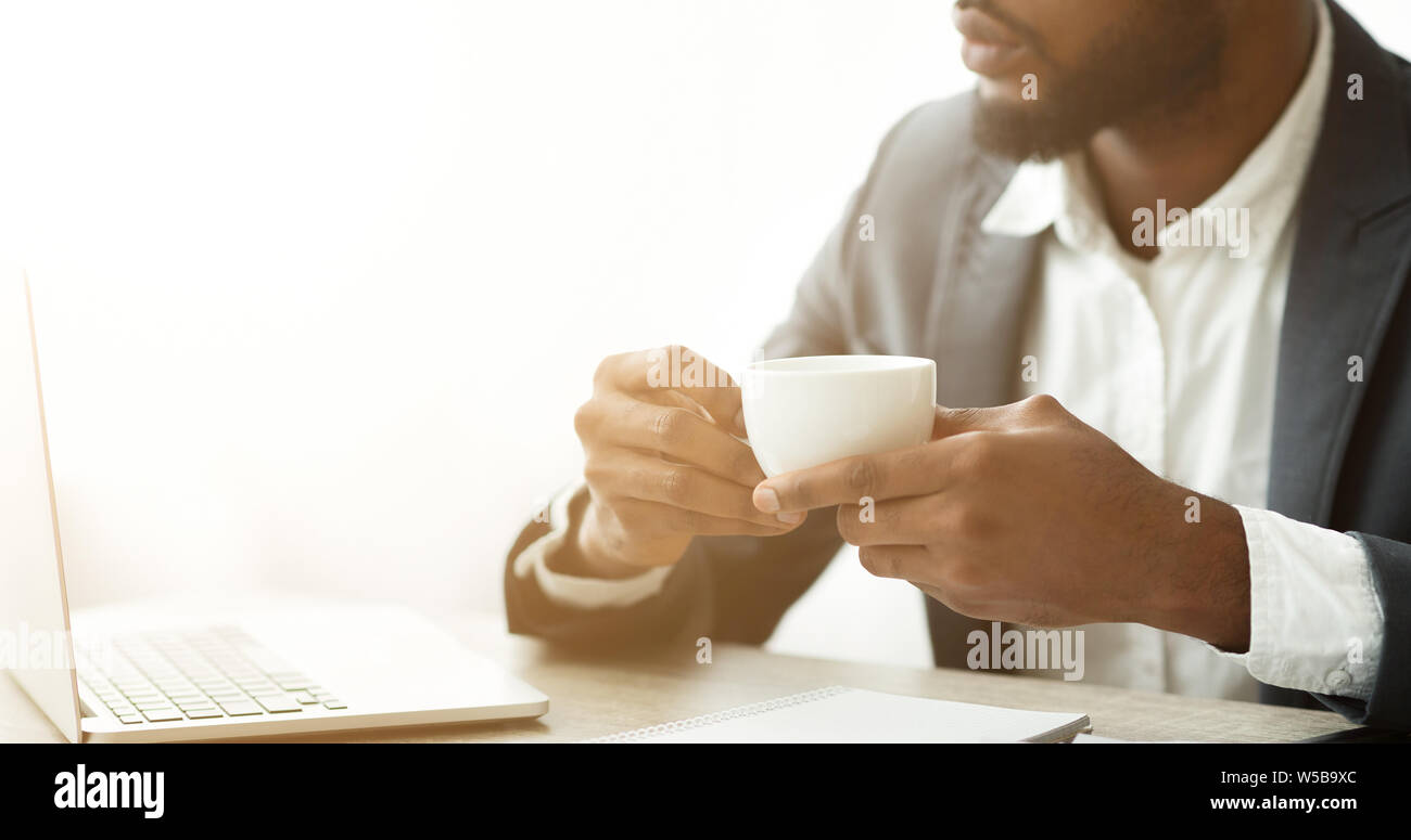 Businessman drinking coffee relaxing desk hi-res stock photography and ...
