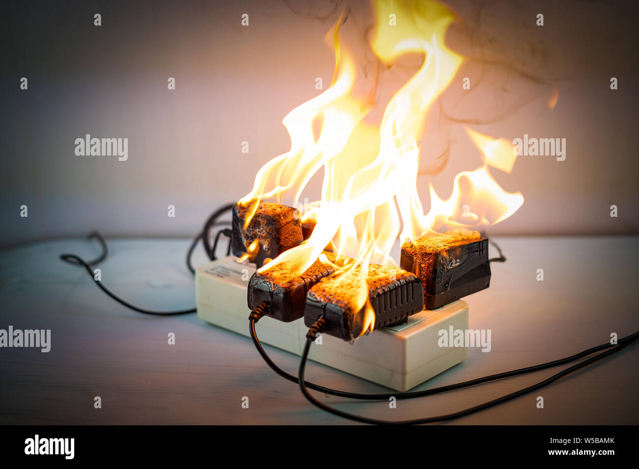 On fire adapter at plug Receptacle on white background, Electric short ...