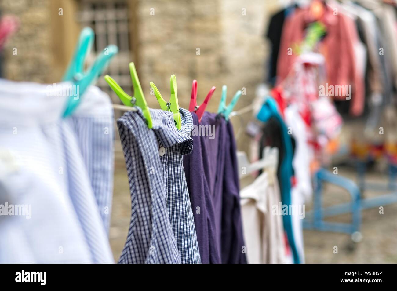 used cloting on a leash Stock Photo - Alamy