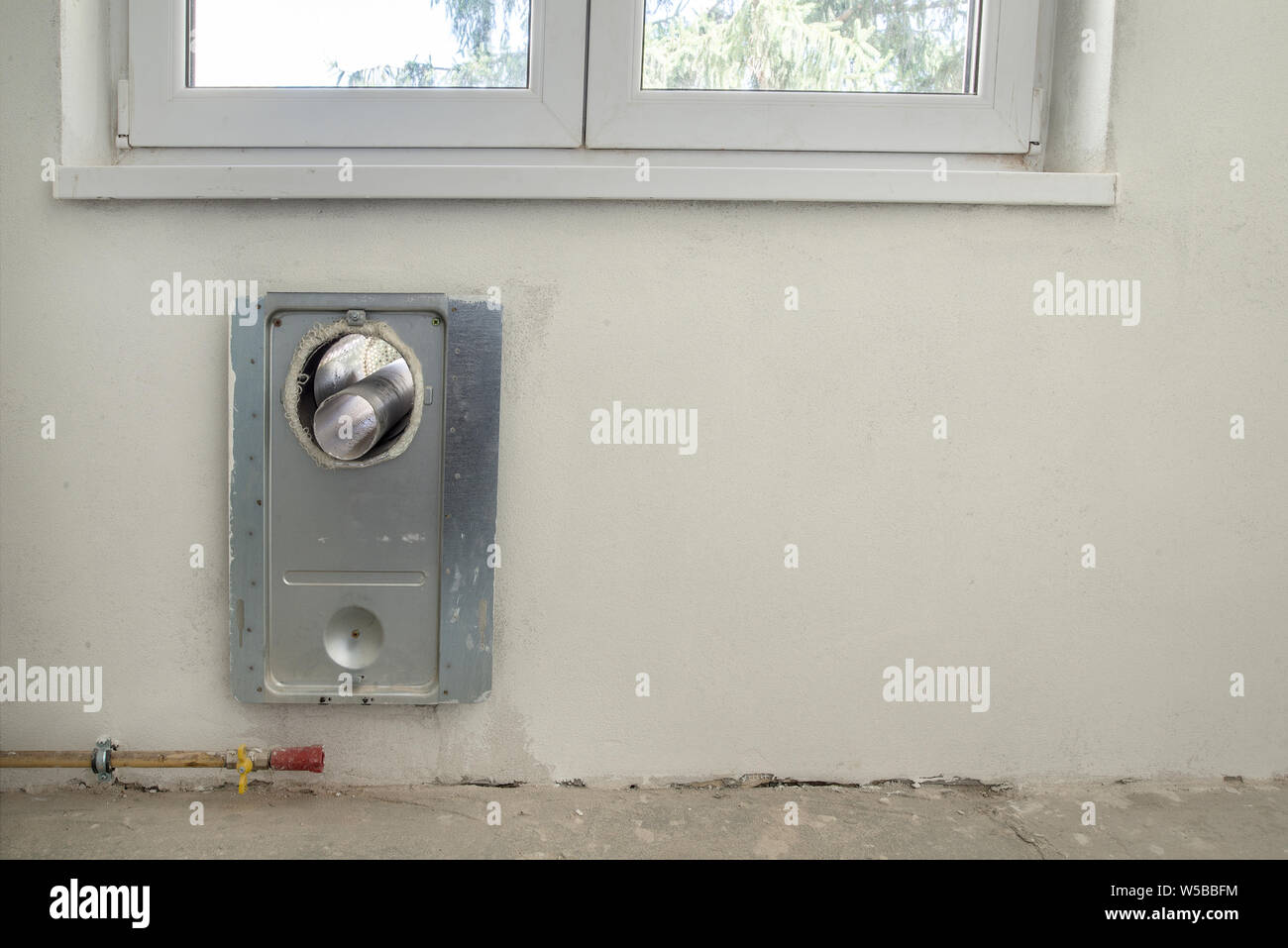 Room reconstruction. Gas heater mounting under the window Stock Photo ...