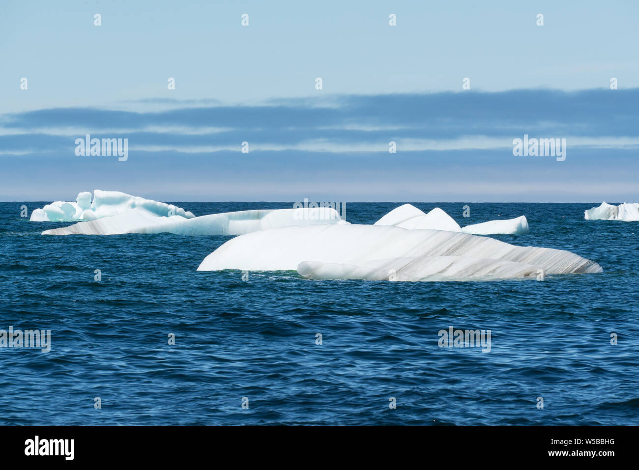 Iceberg floating in the ocean off the coast of Newfoundland, Canada ...