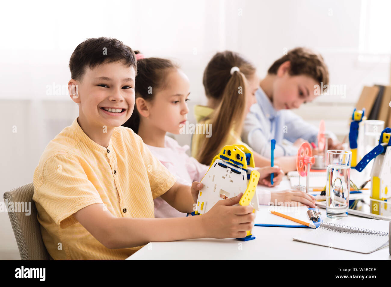 Stem education. Boy creating robot at lab Stock Photo - Alamy