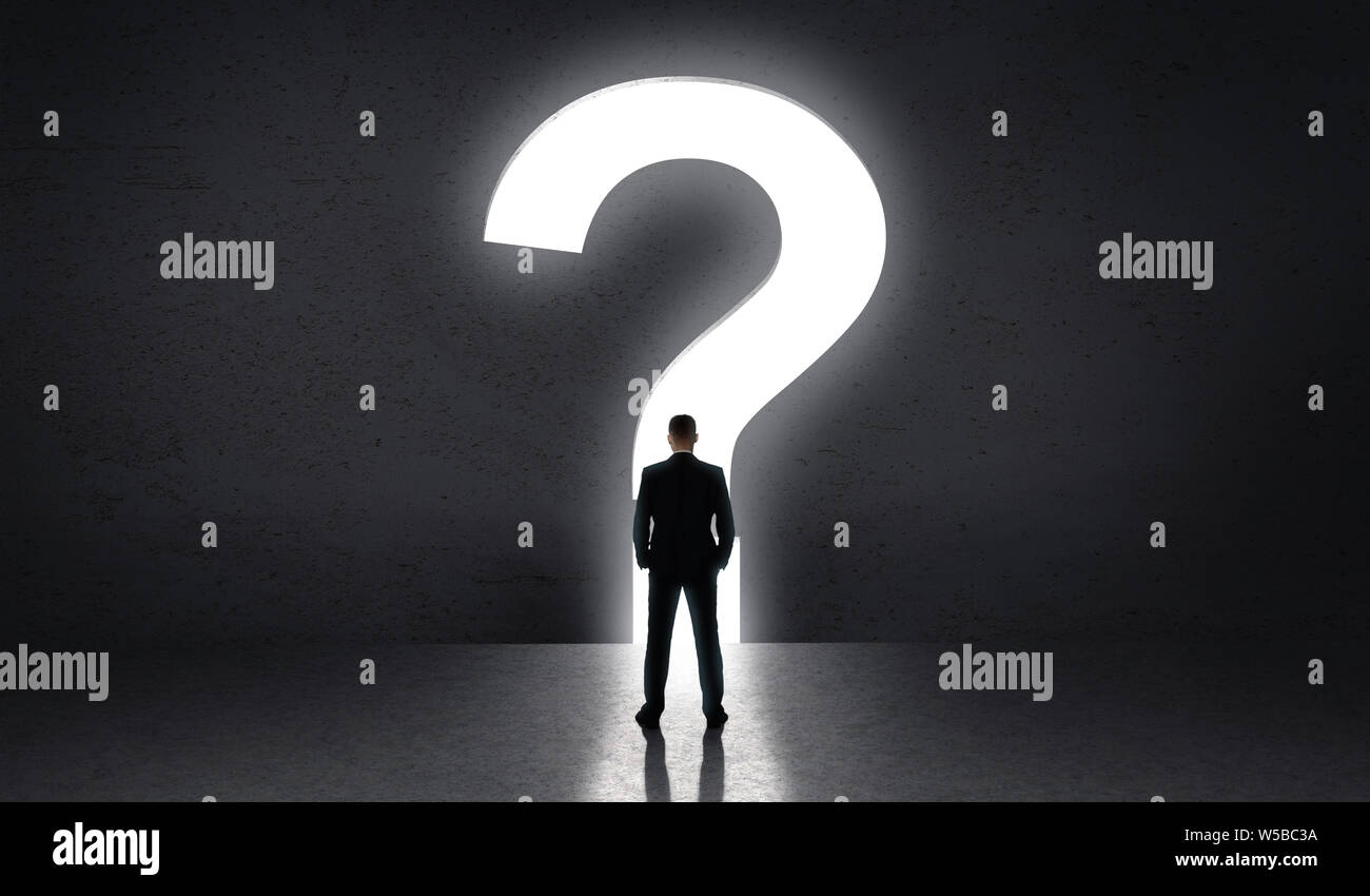 Man standing in front of big question of life Stock Photo - Alamy