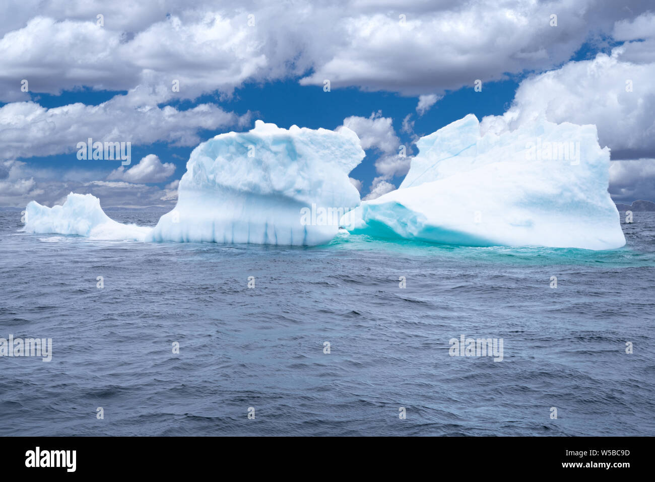 Iceberg floating in the ocean off the coast of Newfoundland, Canada ...