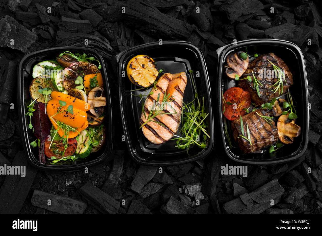 Grilled restaurant food in take away boxes for each person Stock Photo ...