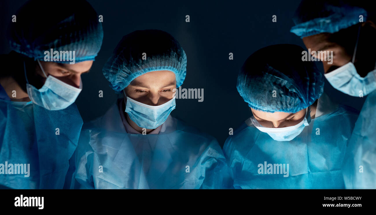 Surgeons perform operation patient in hi-res stock photography and ...