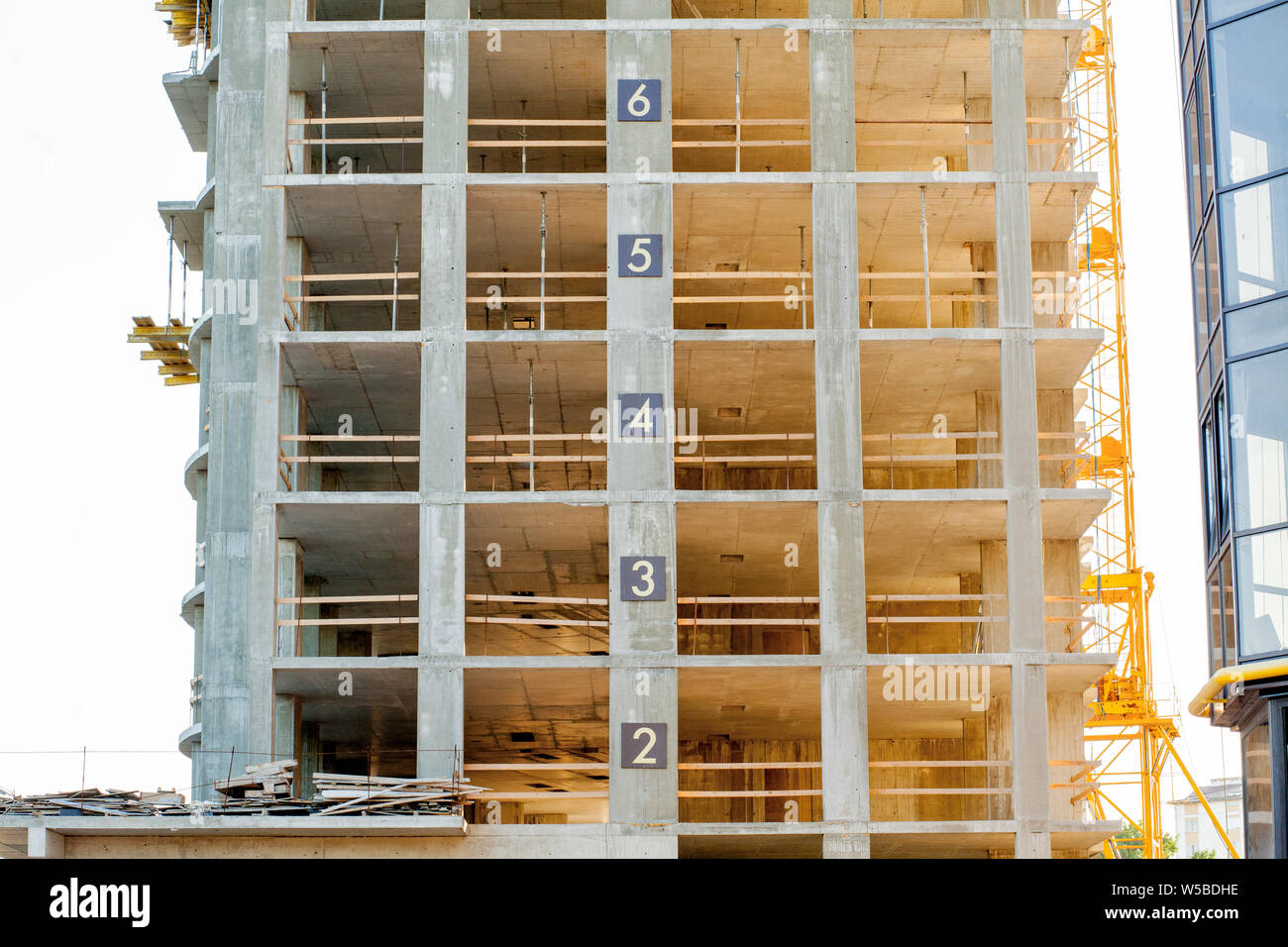 Modern building under construction detail, concrete frame, window ...