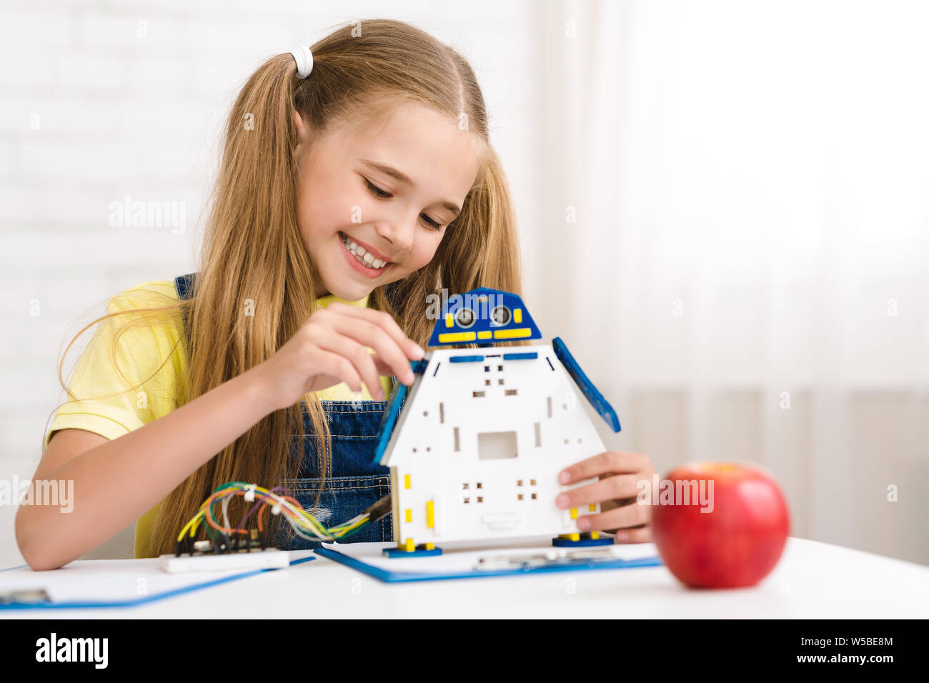 Stem education. Little girl working on new project Stock Photo - Alamy
