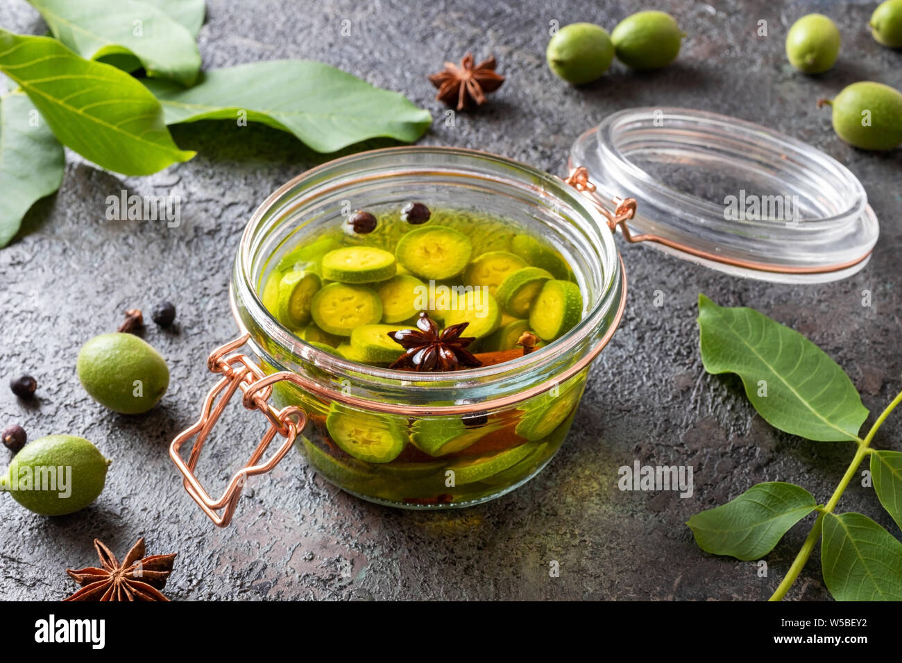 Preparation of homemade nut liqueur from unripe walnuts, star anise ...