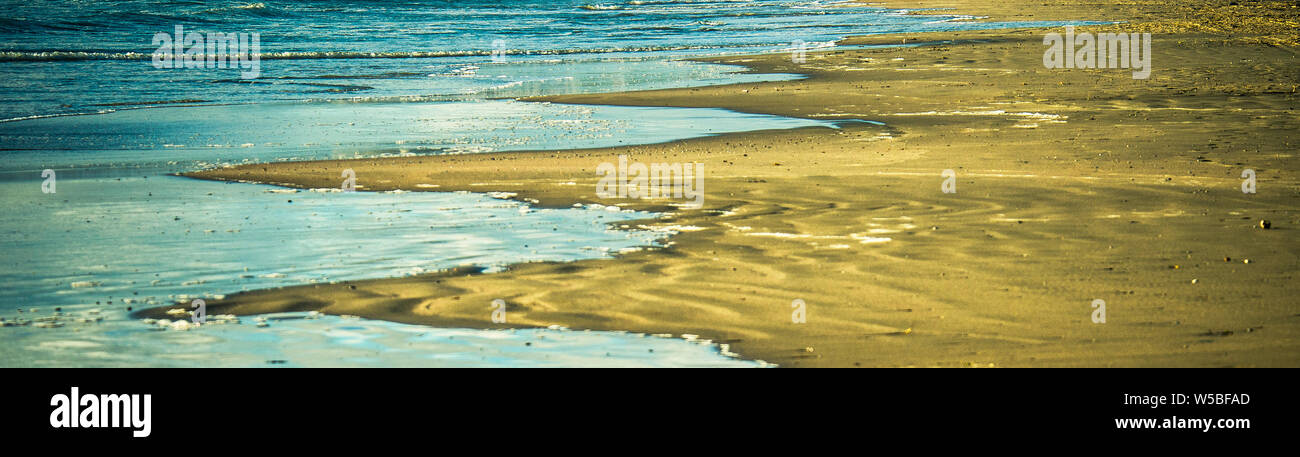 surf in sandy sea beach Stock Photo - Alamy