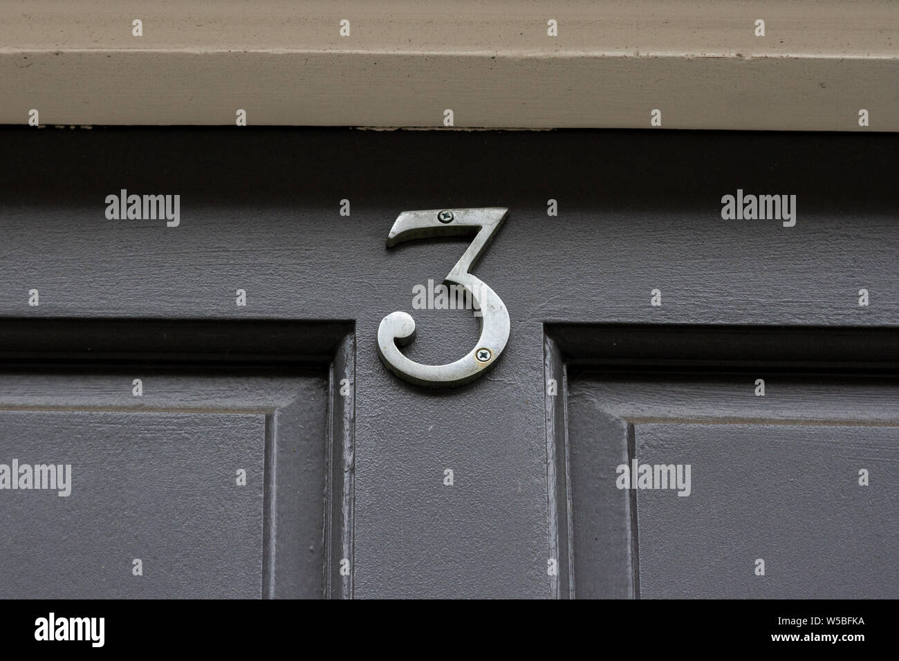 House number 3 on a wooden front door Stock Photo - Alamy