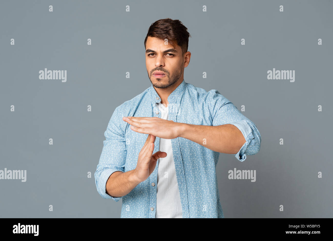 People showing time out hand gesture hi-res stock photography and ...