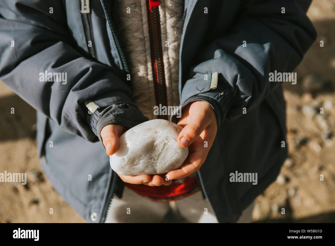 Hands holding rocks child hi-res stock photography and images - Alamy