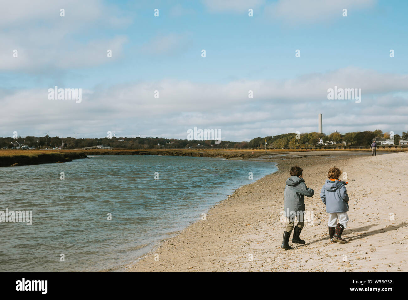 Two boys walking at seashore hi-res stock photography and images - Alamy