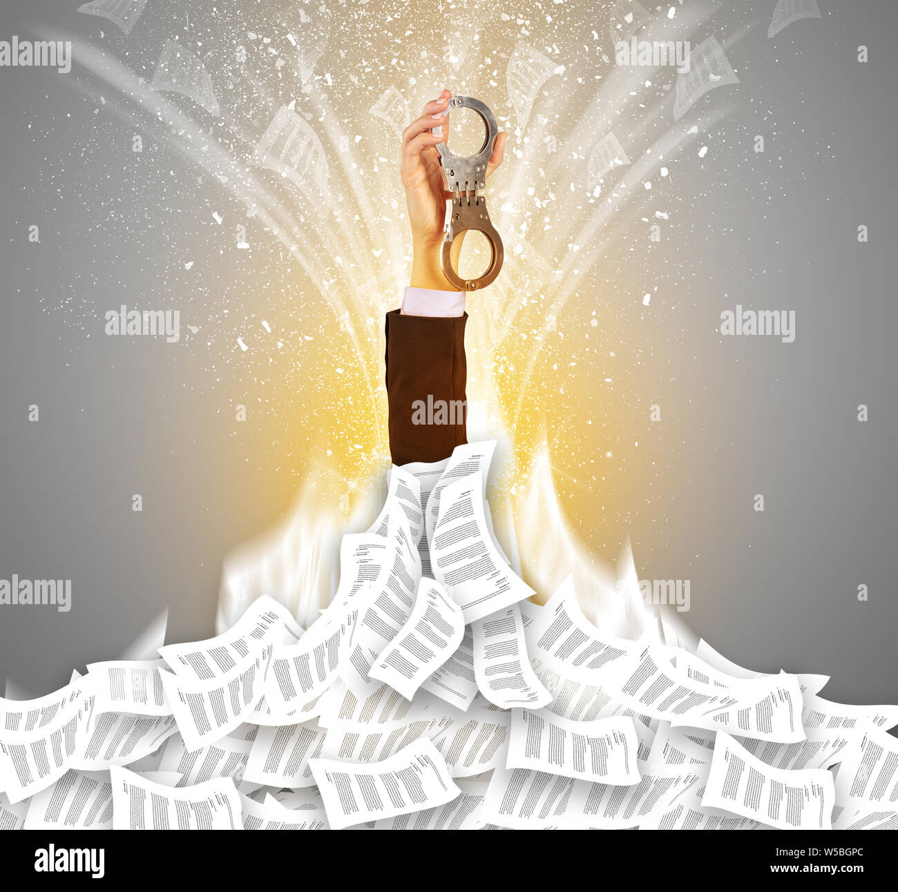 Hand buried in document pile and breaking out from it Stock Photo - Alamy