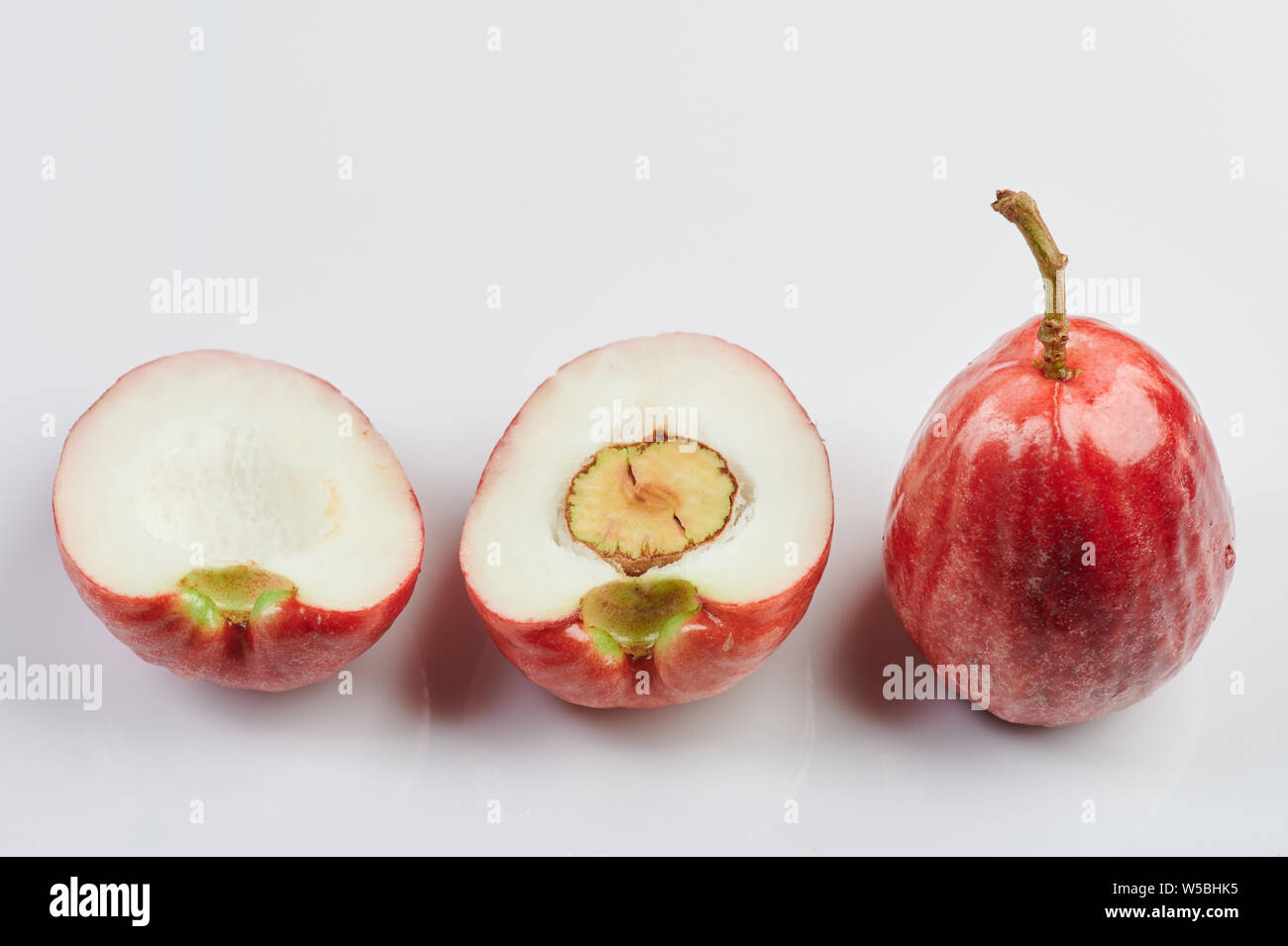 Perote fruit whole and slices on white background Stock Photo - Alamy