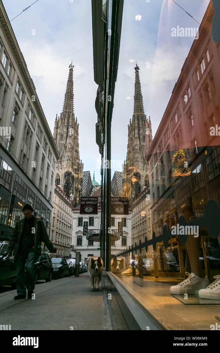 Window reflection street view of St. Stephen's Cathedral which is the ...