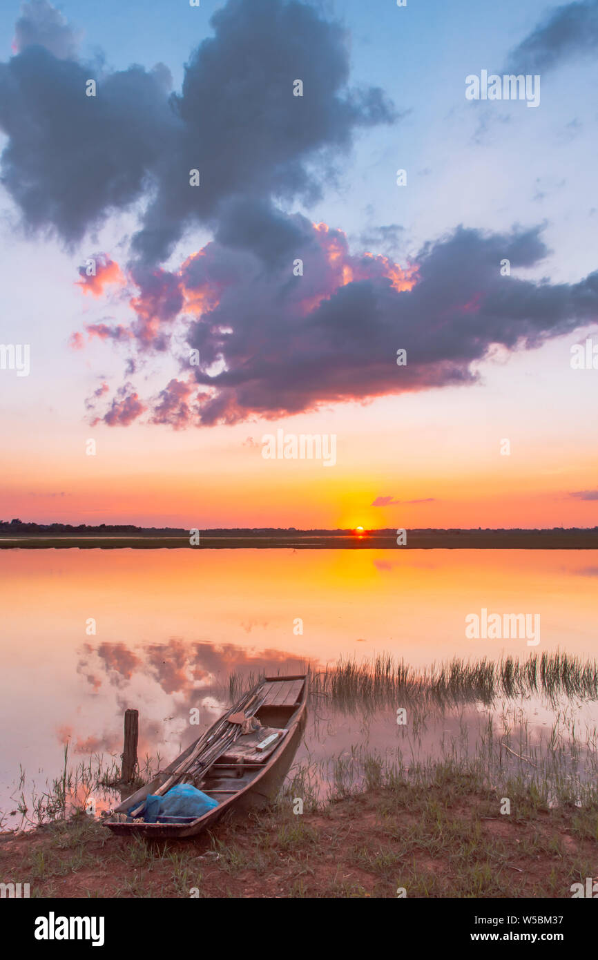 Sunset reflection lagoon. beautiful sunset behind the clouds and blue ... Sunset reflection lagoon. beautiful sunset behind the clouds and blue ...