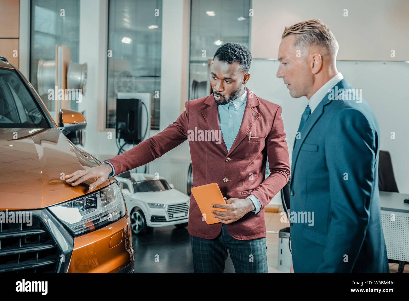Car dealer talking client hi-res stock photography and images - Alamy