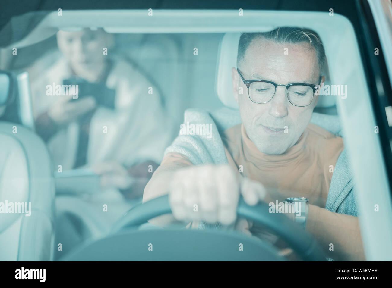 Man being late taking his wife to her work Stock Photo - Alamy