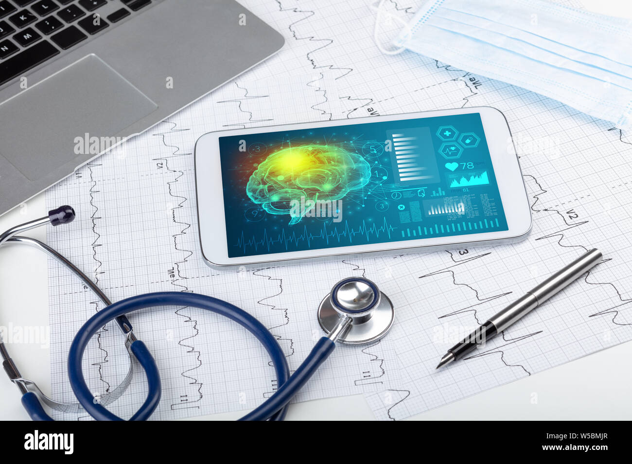 Brain functionality report with medical devices around Stock Photo - Alamy