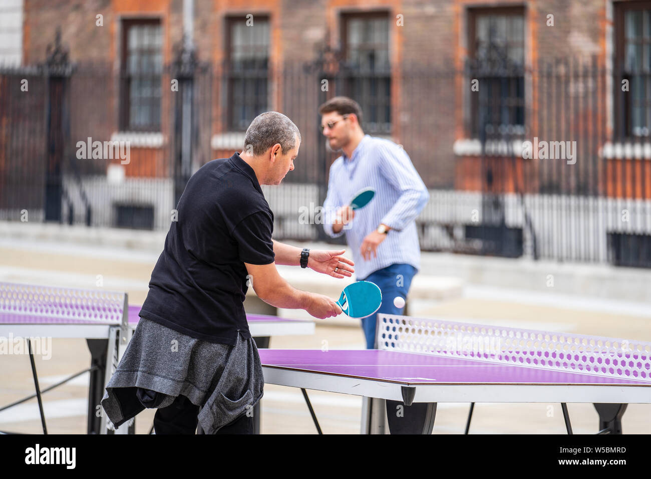 London, UK, July 14, 2019. People playing ping pong near St Pauls ...