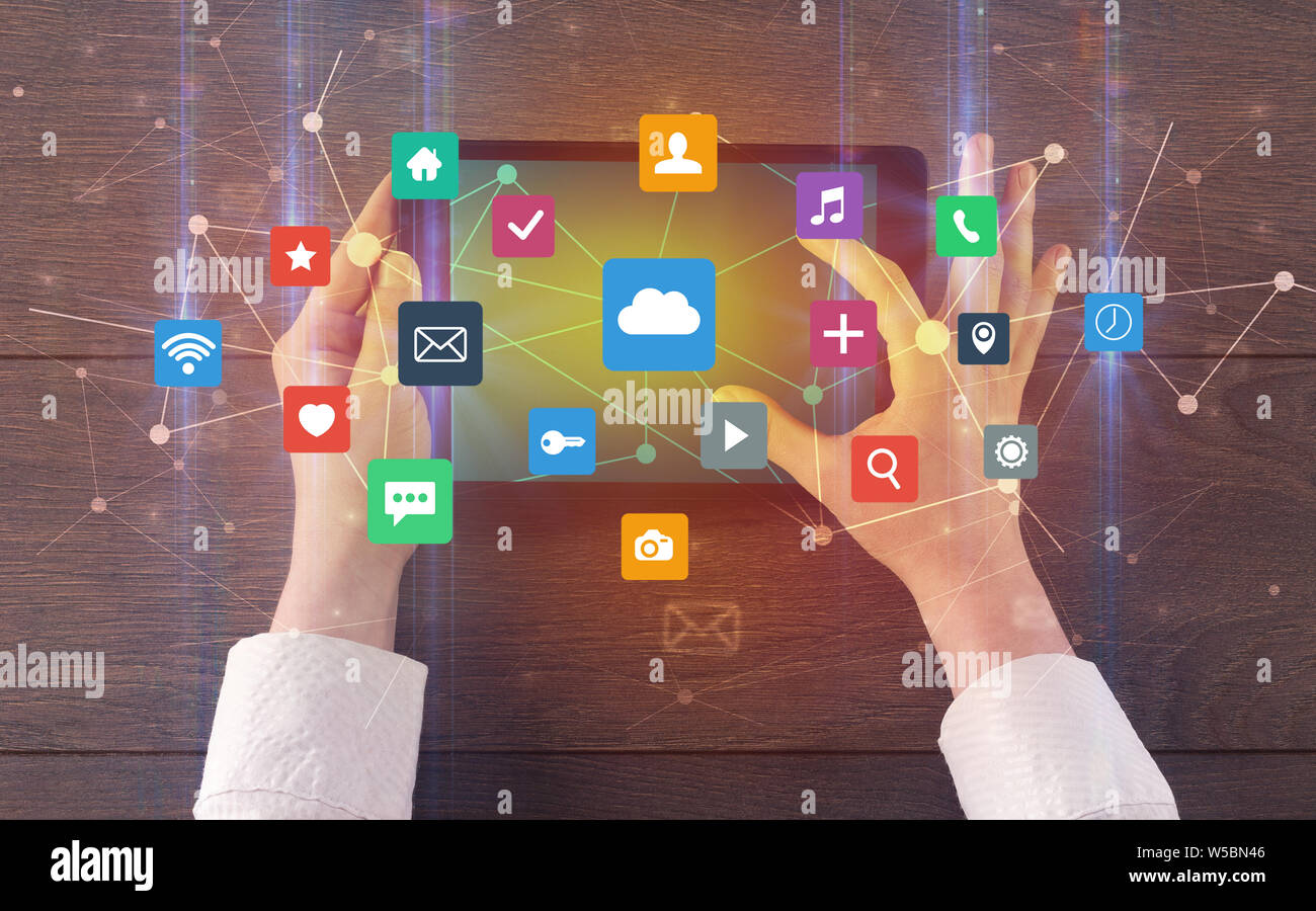 Hand touching multitask tablet with cloud wifi message social media ...