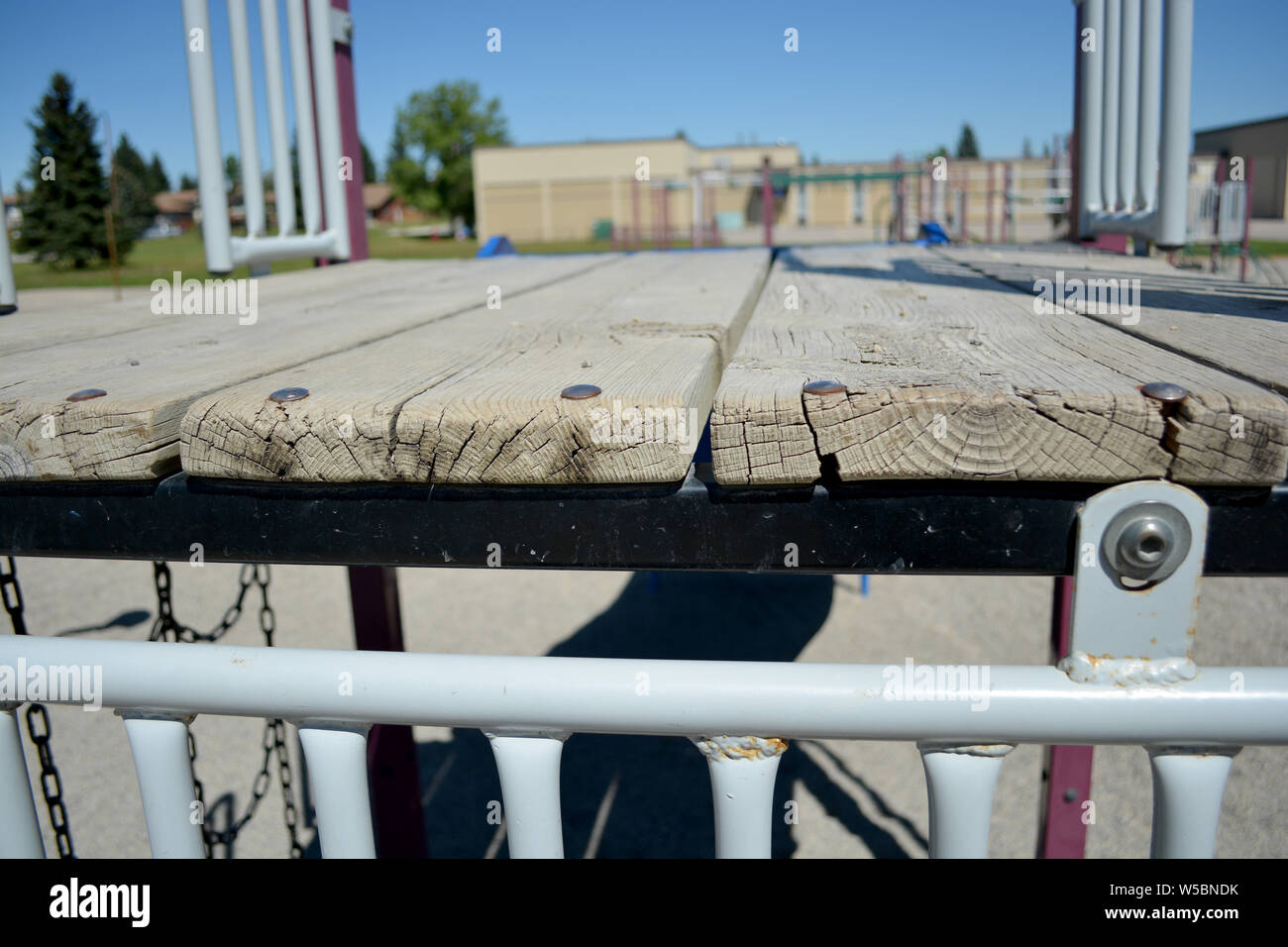 Playground wood step in school yard with school in background Stock ...