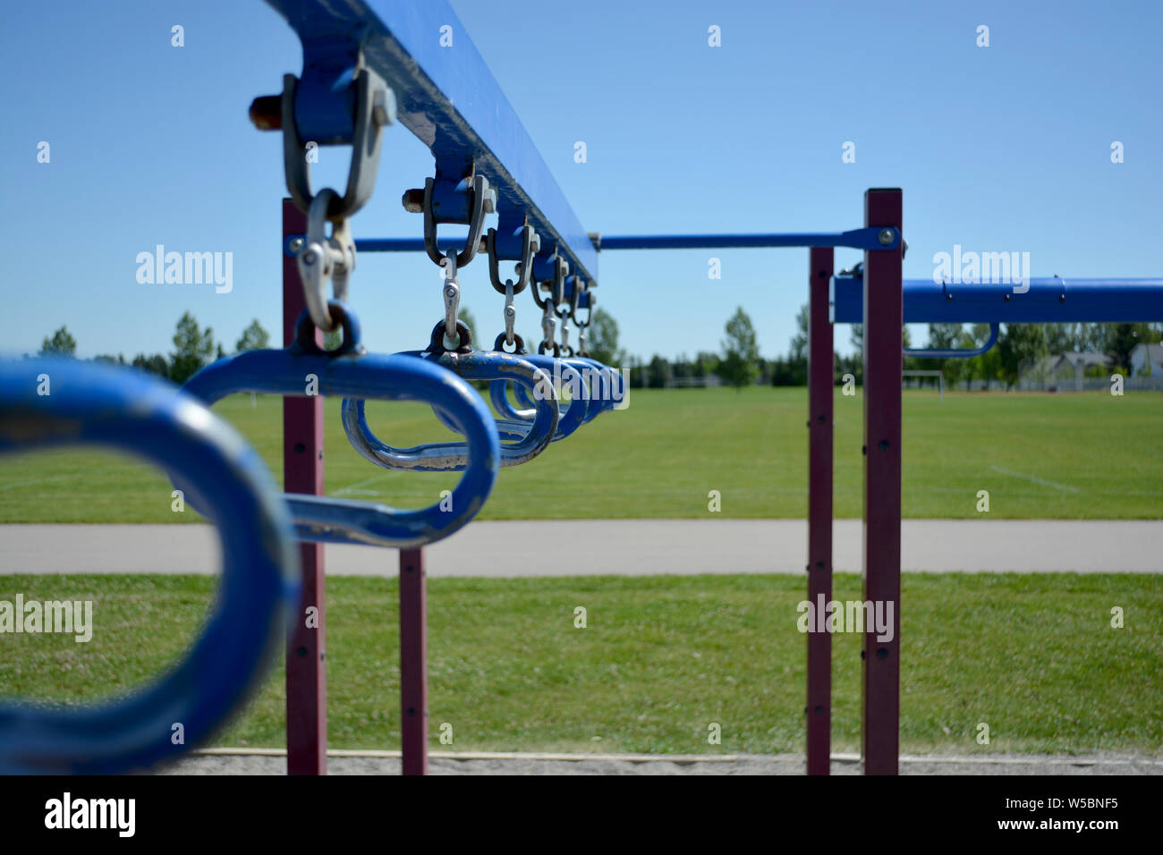 Colourful playground handles in school yard with focus on handle Stock ...