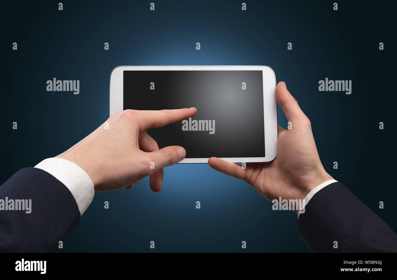 Hand using tablet with no concept and empty space Stock Photo - Alamy