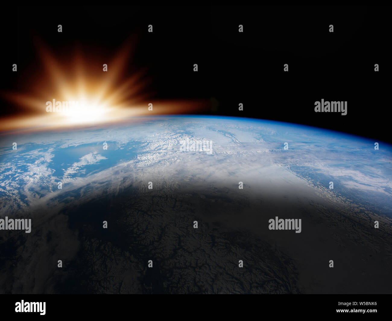Sunrise over the Earth on ocean with sunlight and universe concept. This image furnished by NASA ...