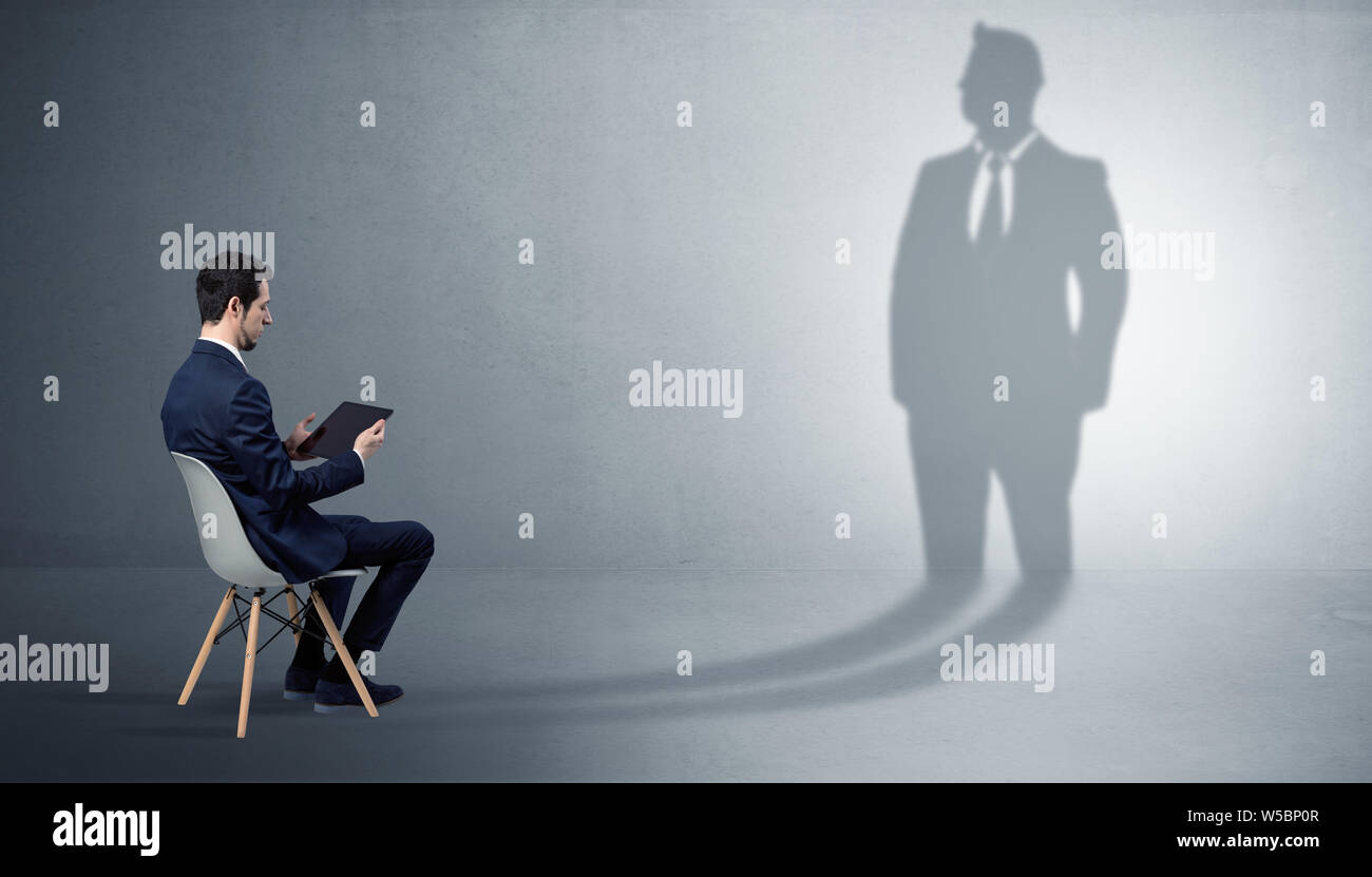 Humble businessman staying and offering stuffs to a huge businessman ...
