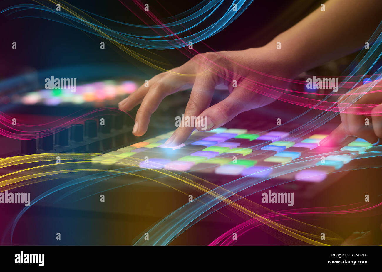 Hand mixing music on midi controller with colorful vibe concept Stock ...