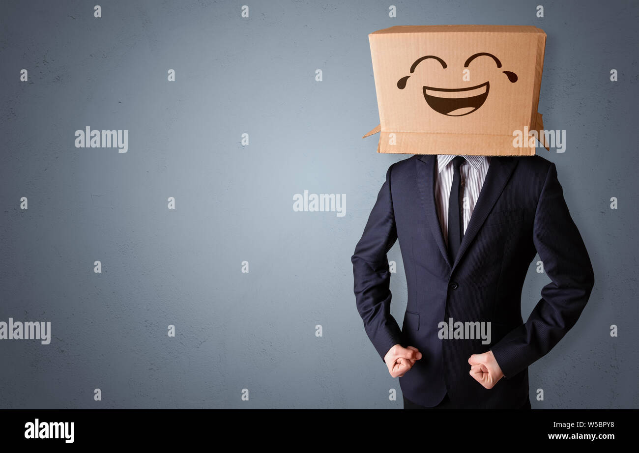 Funny man wearing cardboard box on his head with smiley face Stock ...