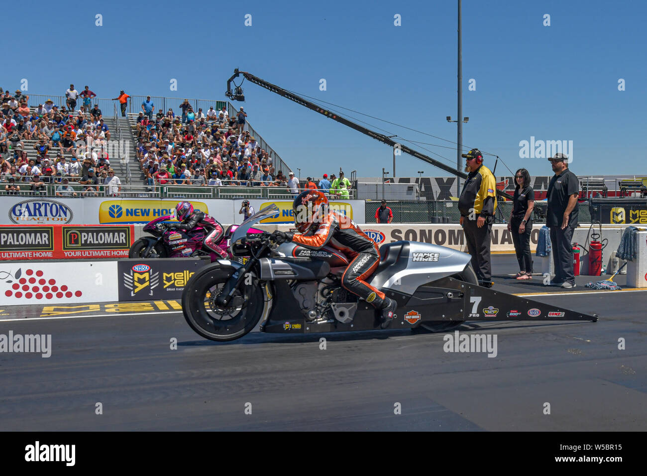 Sonoma, California, USA. 27th July, 2019. Angelle Sampey launches her pro stock bike in the left ...