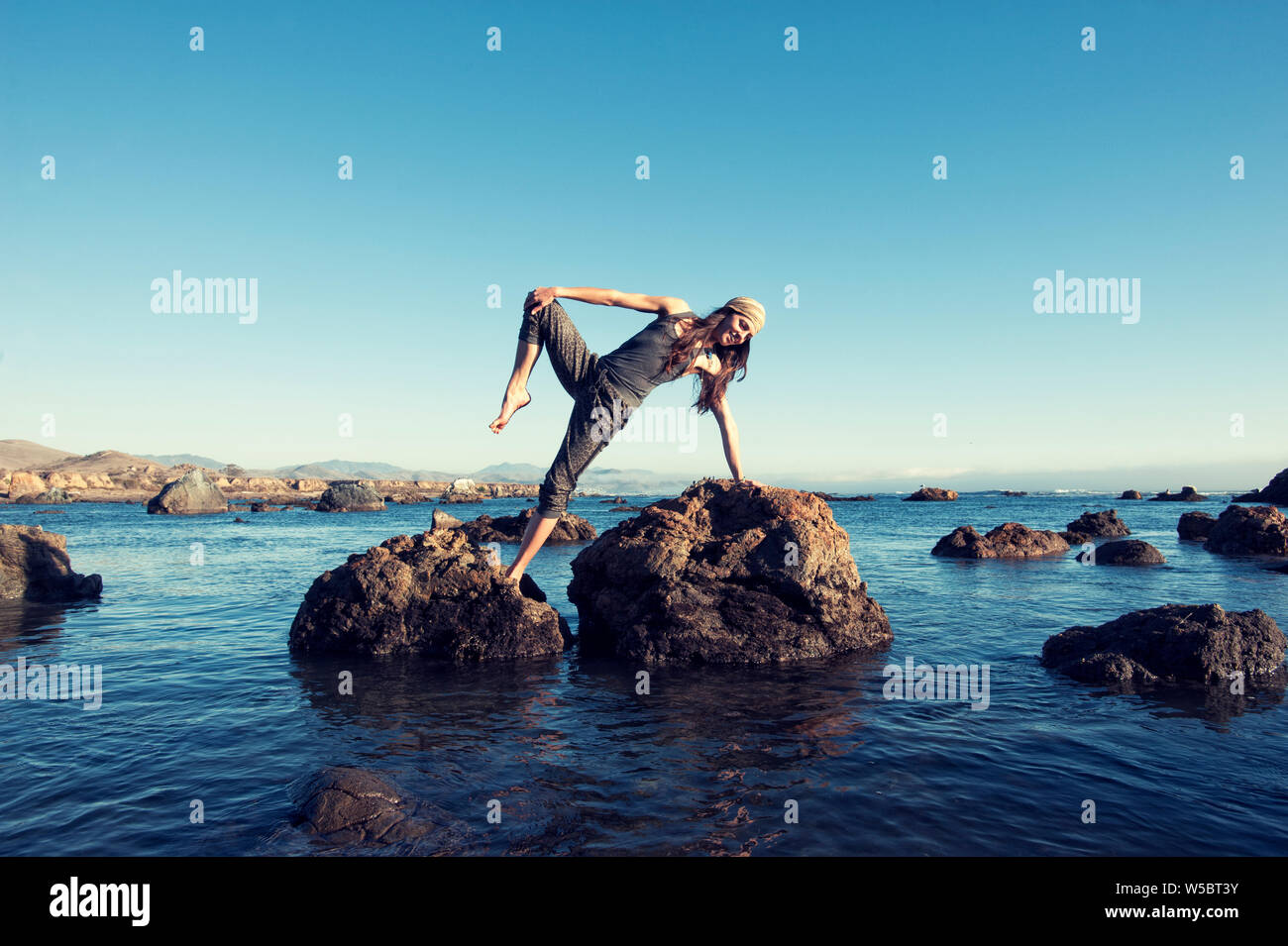 Natural yogini by the sea. SLO Stock Photo - Alamy