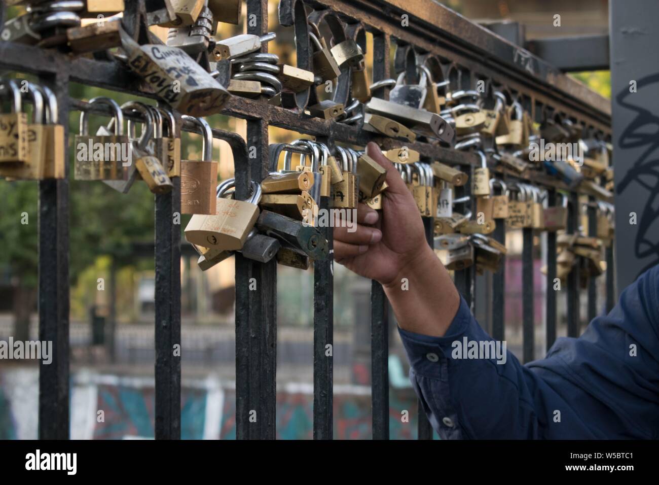SANTIAGO, CHILE - Jul 26, 2019: Close up on a hand holding a padlock ...