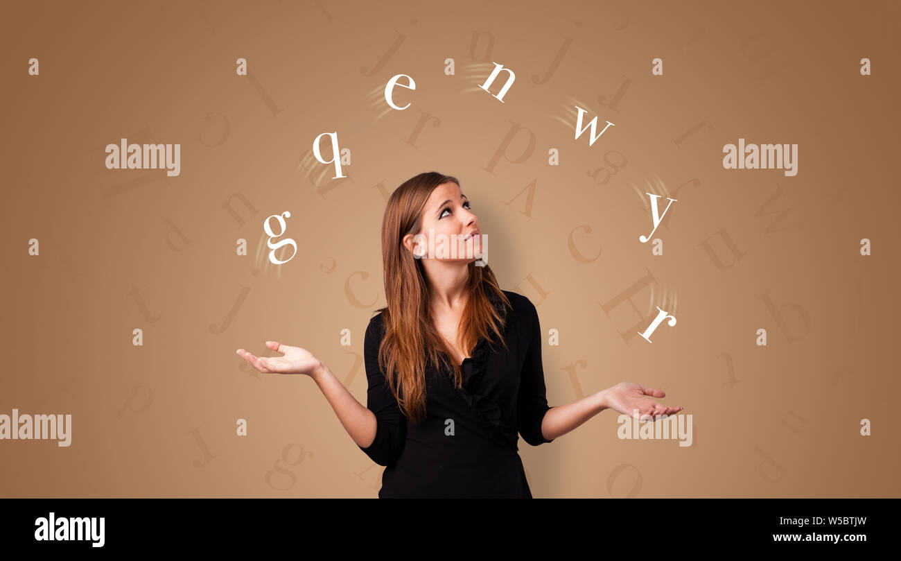 Young student juggle with letters Stock Photo - Alamy