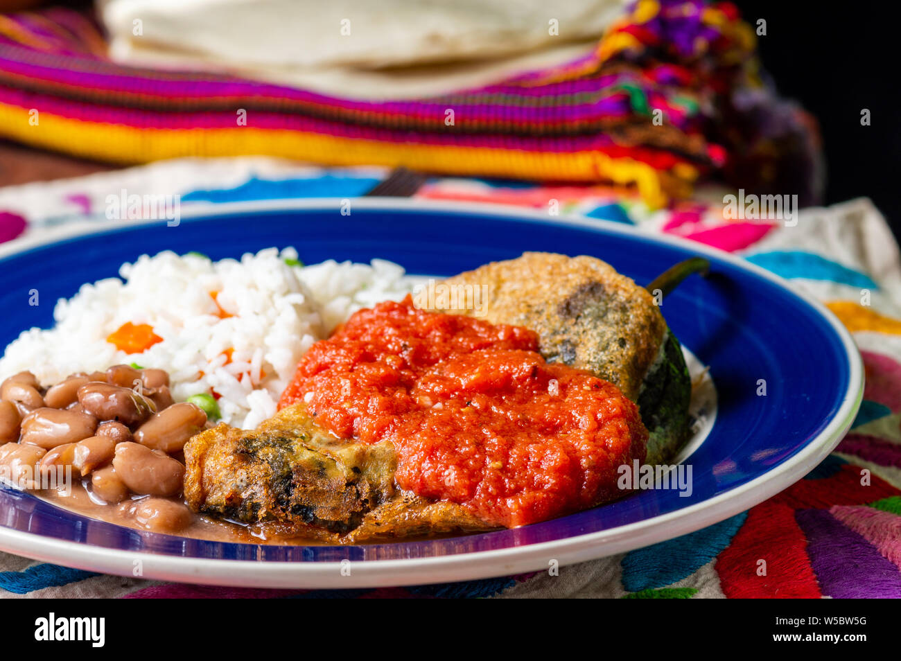 Mexican stuffed chilies (Chiles Rellenos), poblano chilis filled with ...